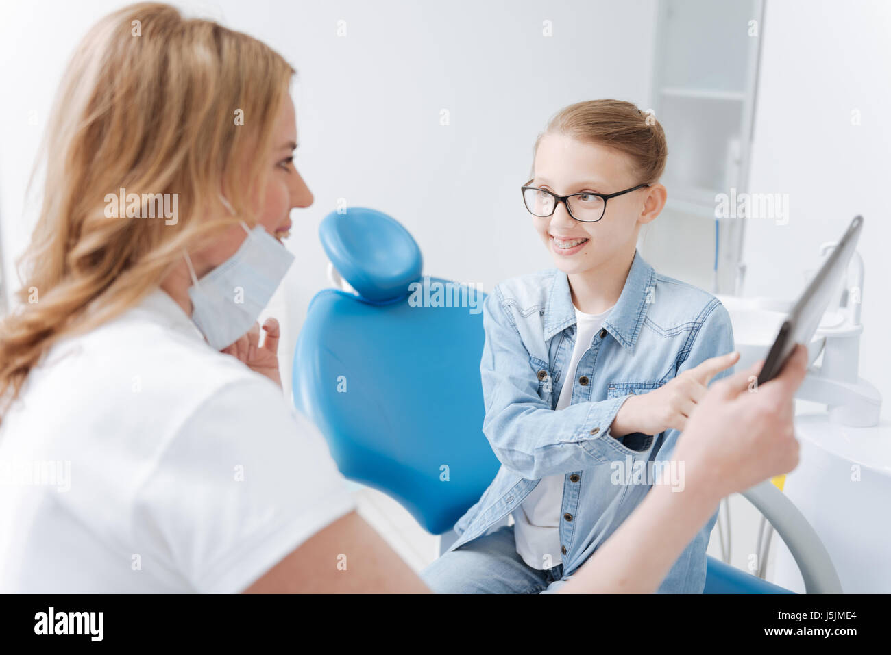 Clever young patient asking questions about treatment Stock Photo - Alamy