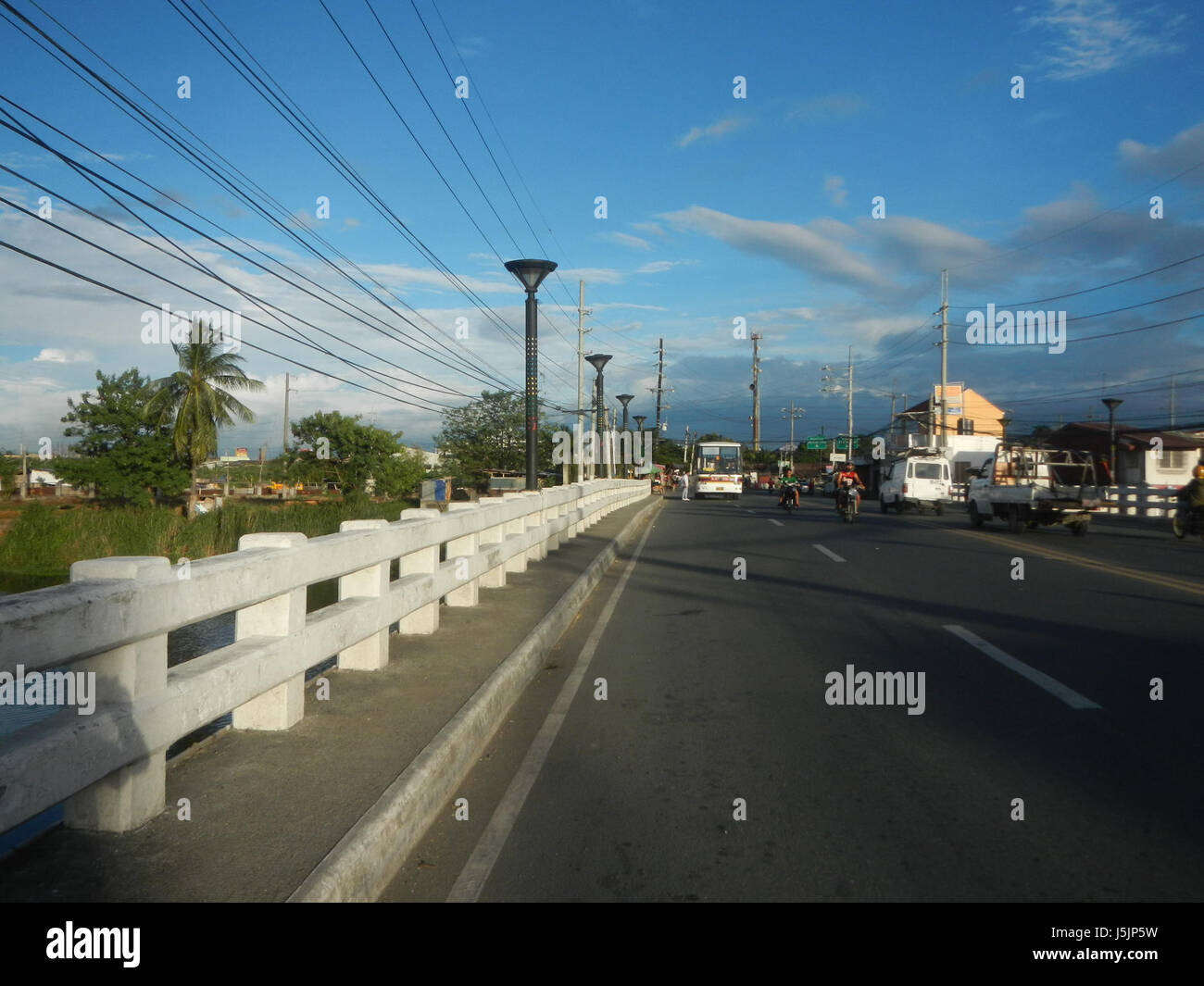 This photograph features a stunning sunset view over the Bocaue River ...