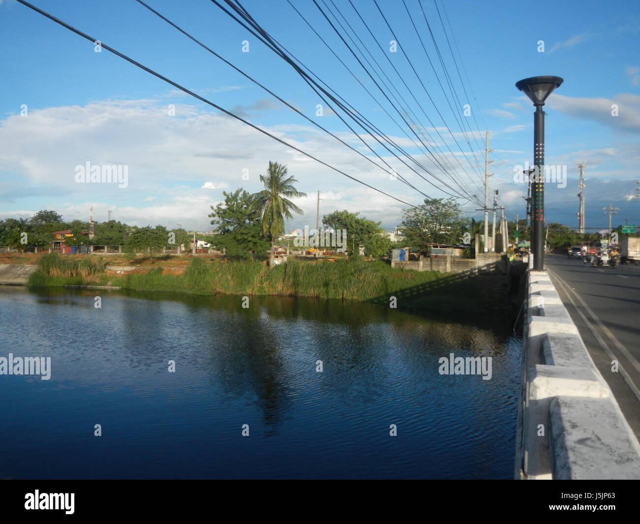 The Bocaue River Bridge, located in Bocaue, Bulacan, Philippines, spans ...