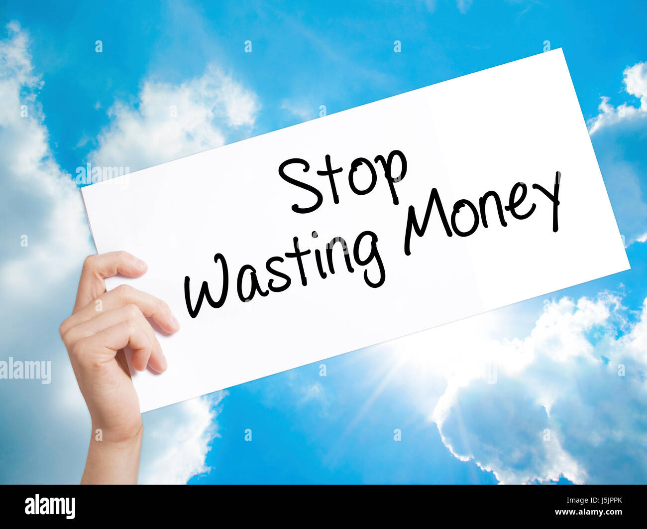 Stop Wasting Money Sign on white paper. Man Hand Holding Paper with ...