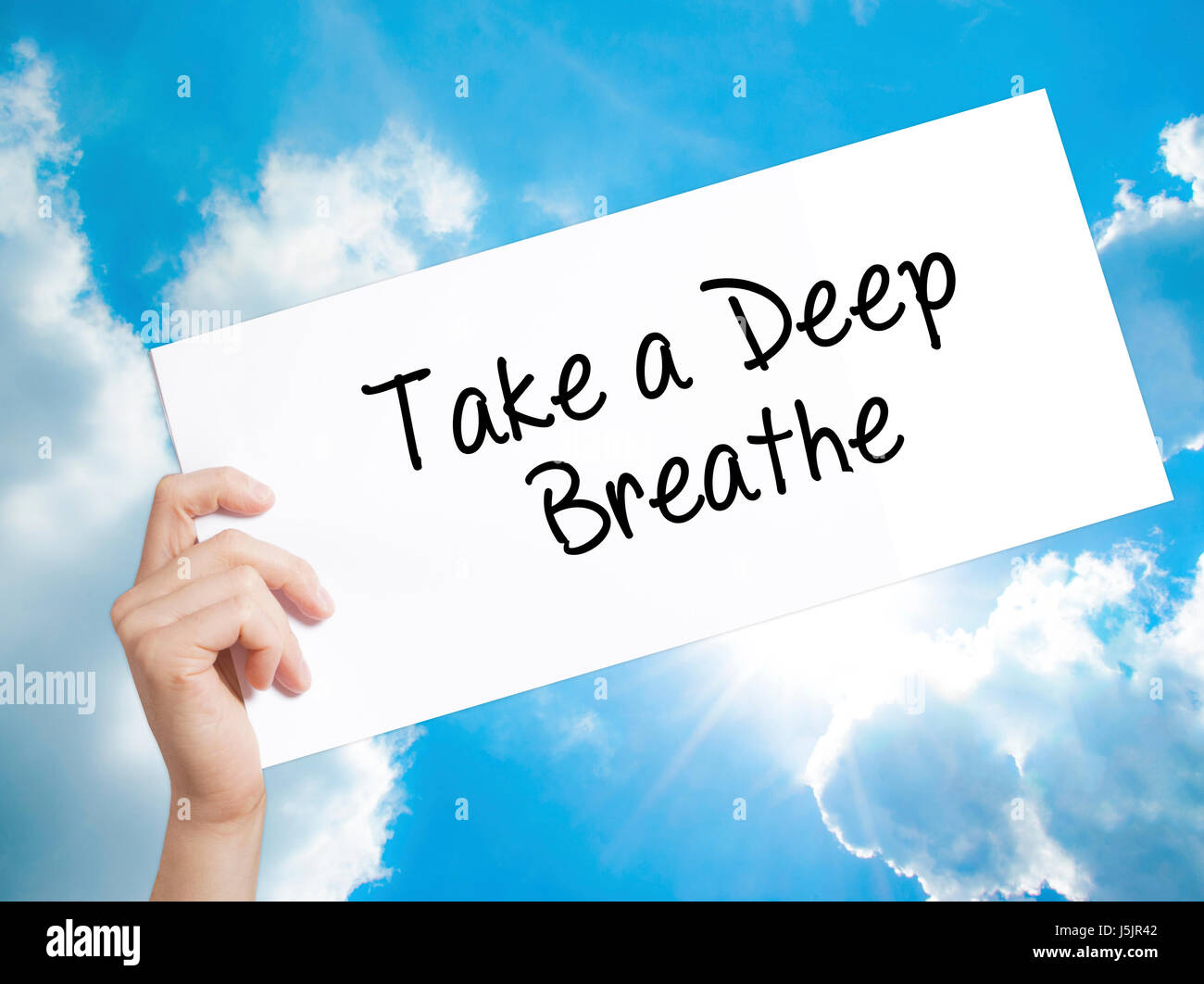 Take a Deep Breathe Sign on white paper. Man Hand Holding Paper with ...