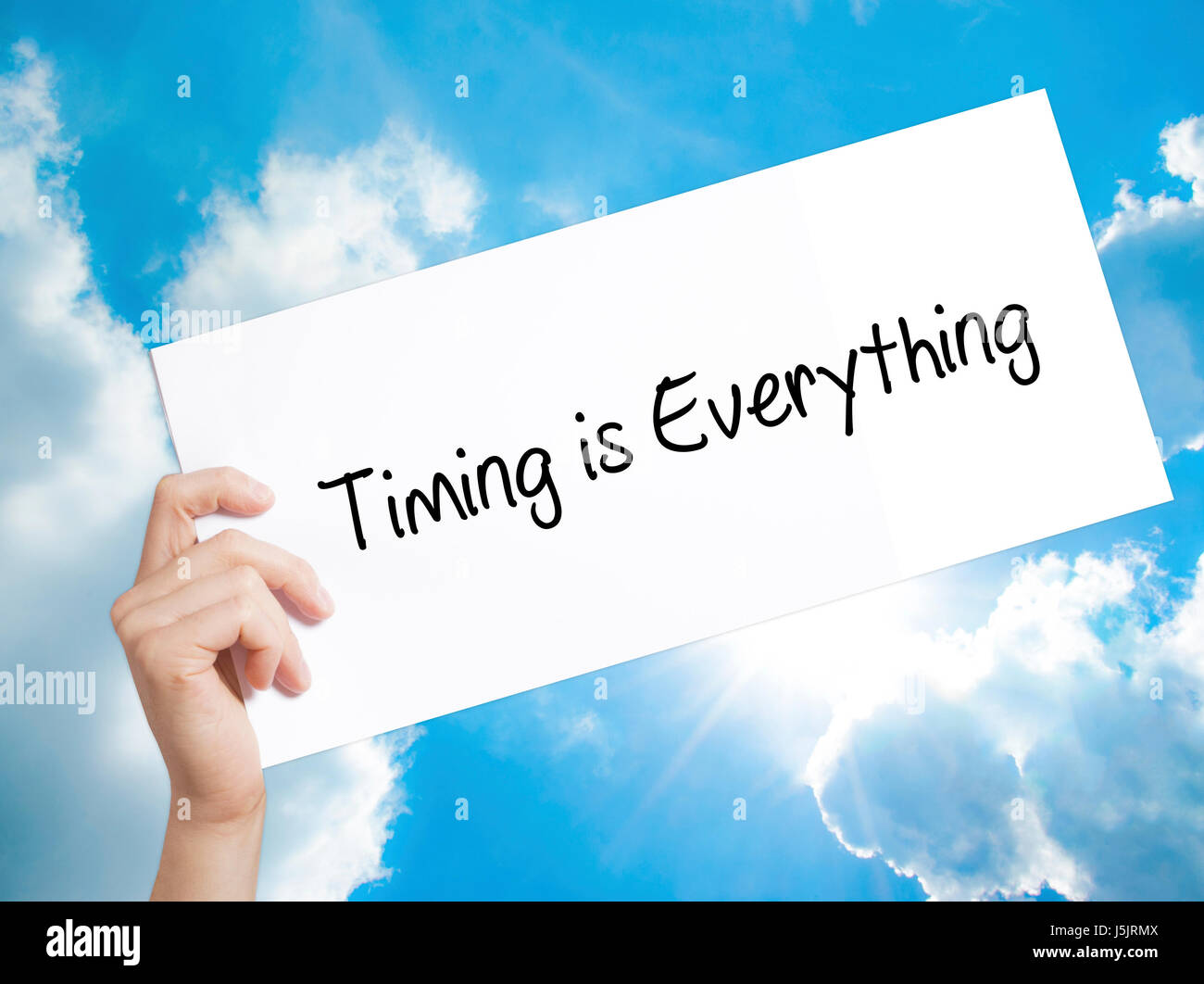 Timing is Everything Sign on white paper. Man Hand Holding Paper with ...