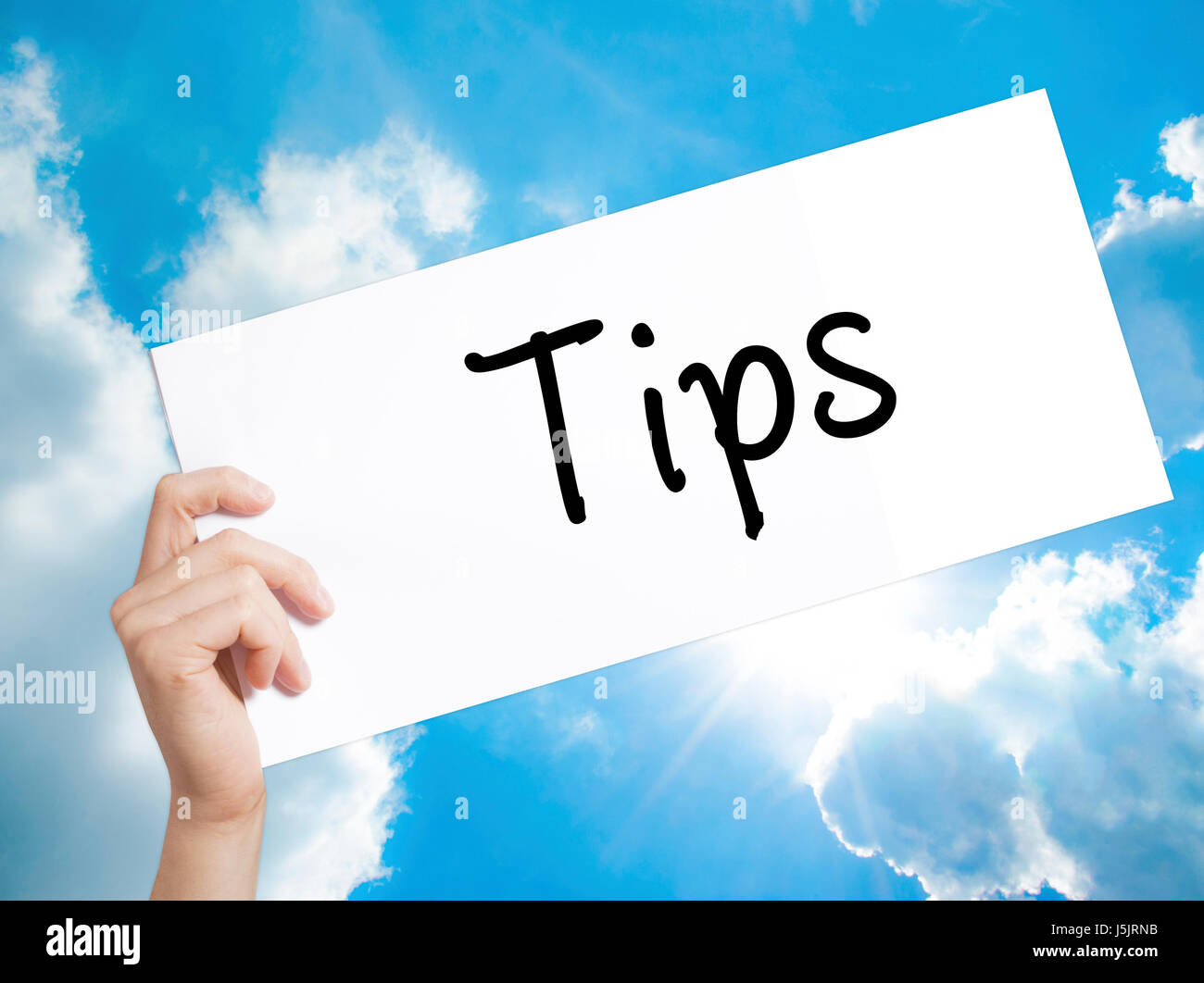 Tips Sign on white paper. Man Hand Holding Paper with text. Isolated on ...