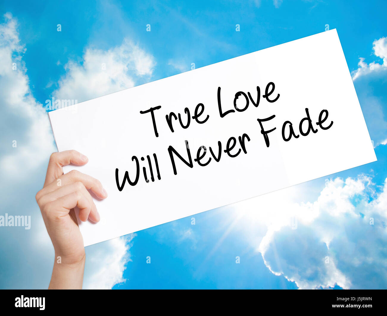 True Love Will Never Fade Sign on white paper. Man Hand Holding Paper ...