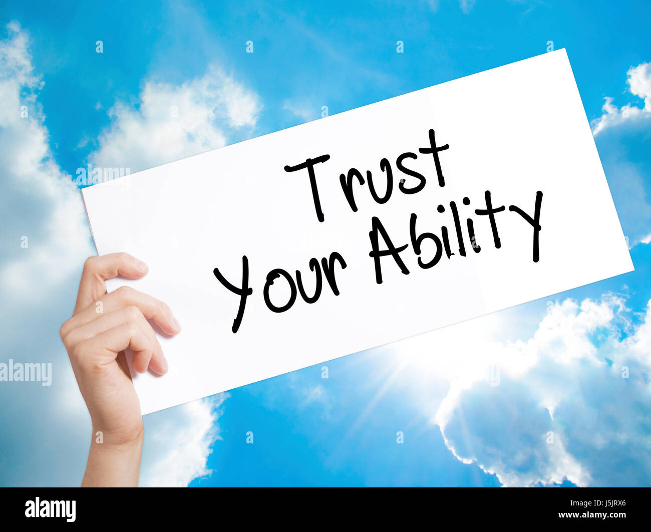 Trust Your Ability Sign on white paper. Man Hand Holding Paper with ...