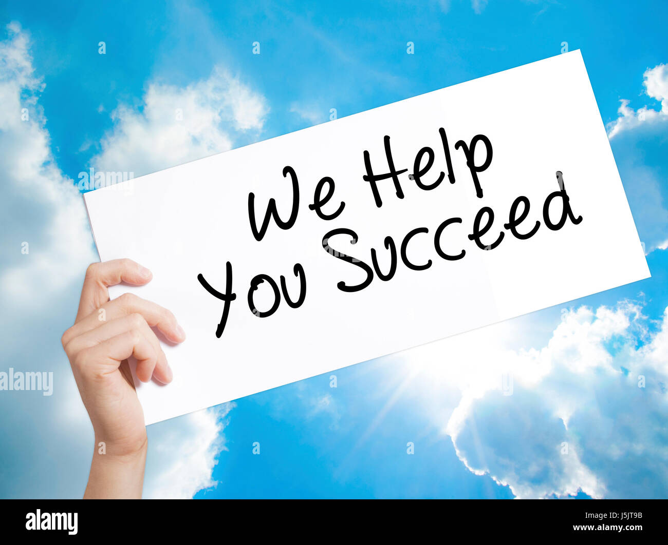 We Help You Succeed Sign on white paper. Man Hand Holding Paper with ...