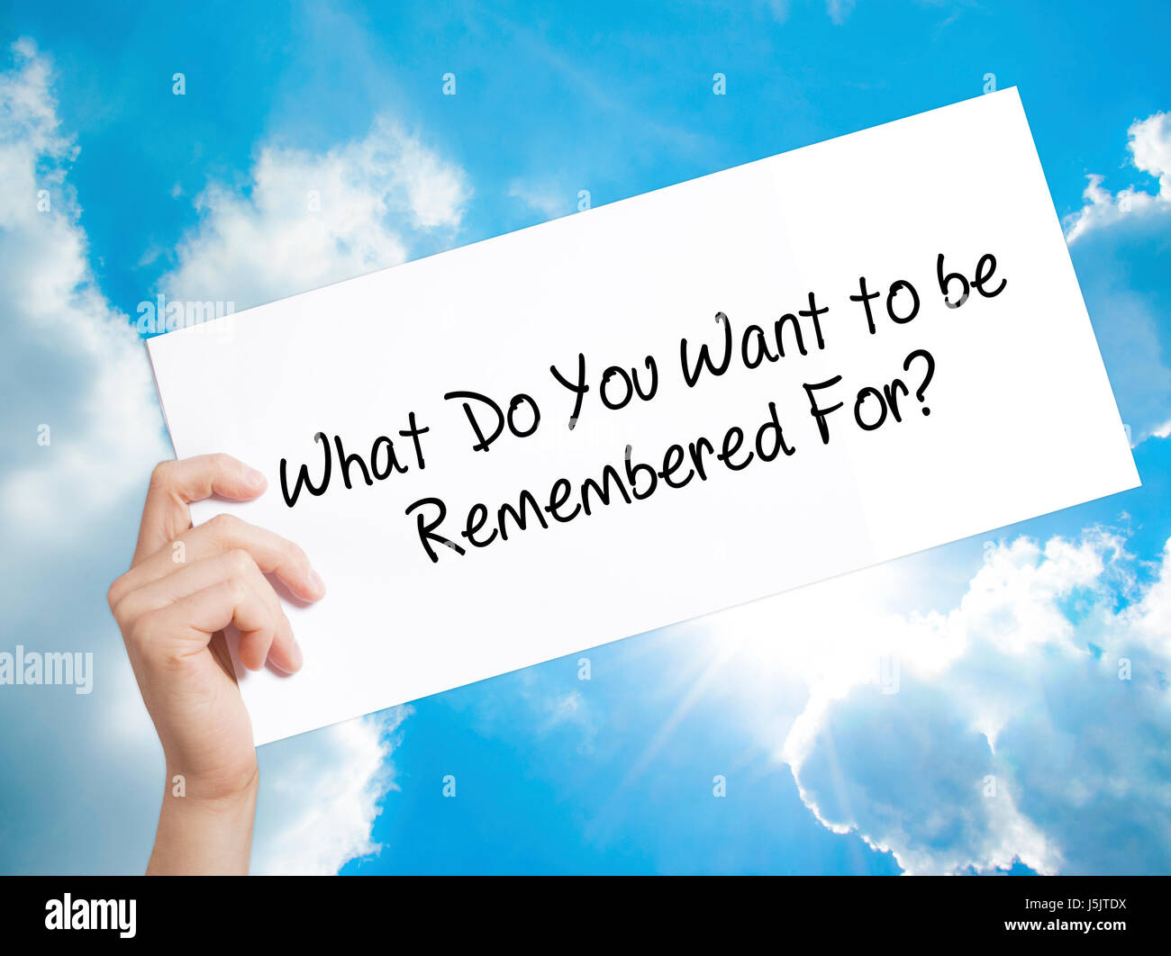 What Do You Want to be Remembered For? Sign on white paper. Man Hand ...