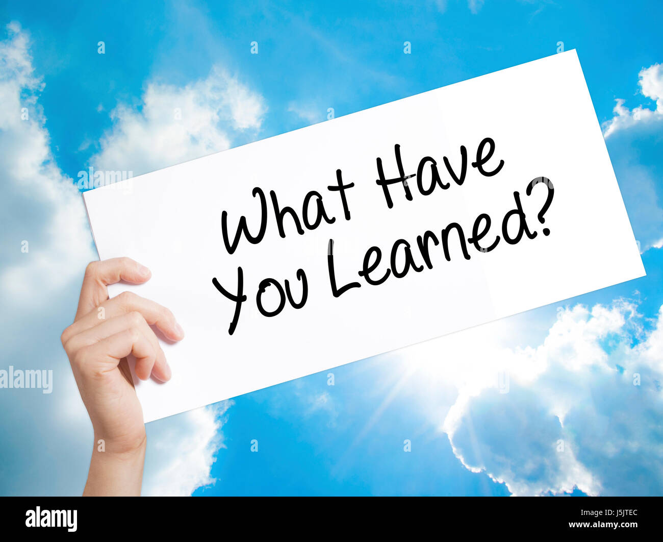 What Have You Learned? Sign on white paper. Man Hand Holding Paper with ...