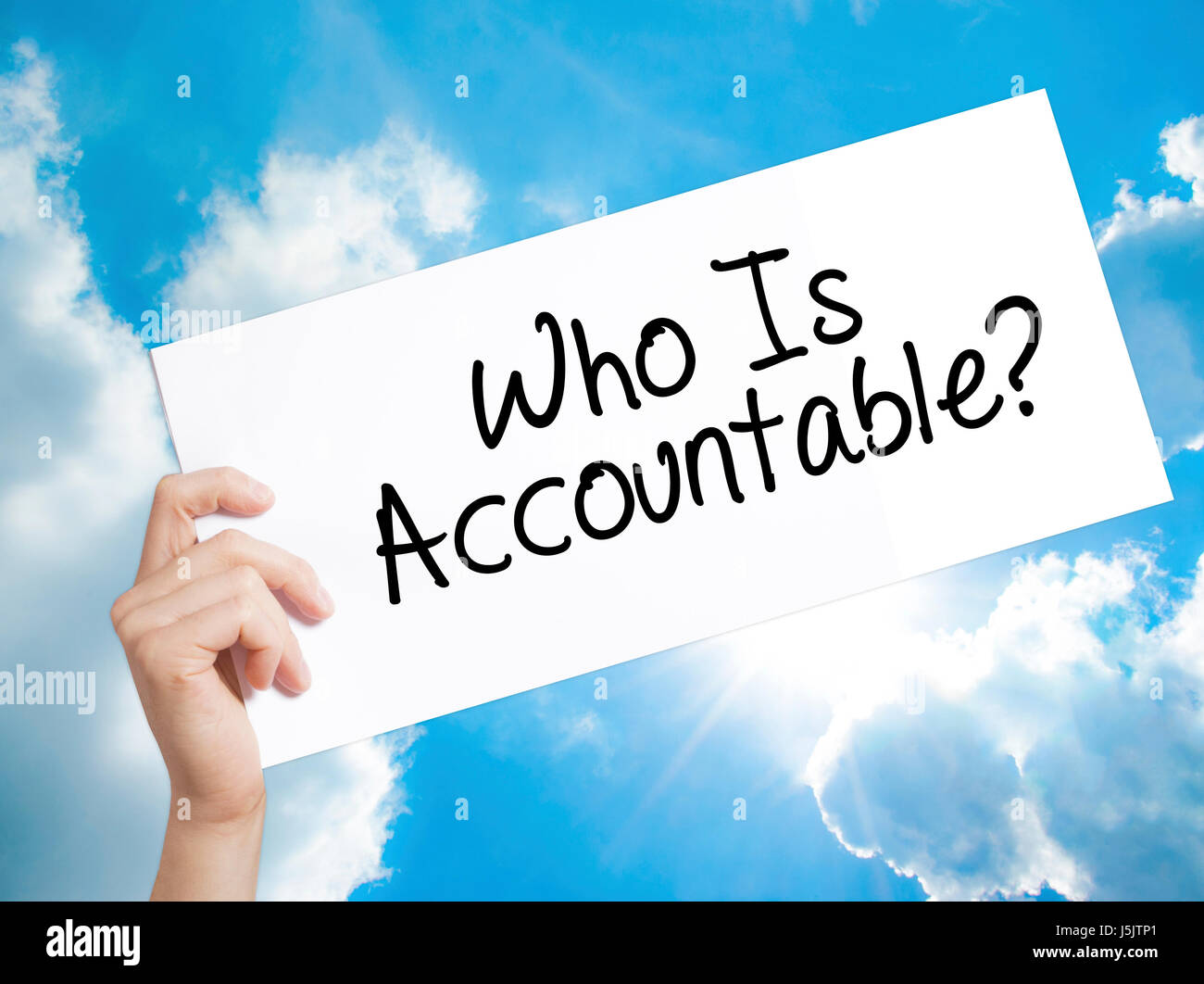 Who Is Accountable? Sign on white paper. Man Hand Holding Paper with ...