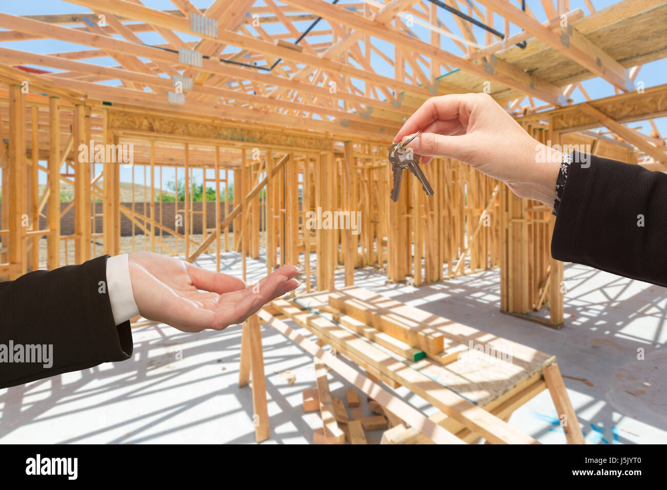 Handing Over The Keys On Site Inside New Home Construction Framing ...