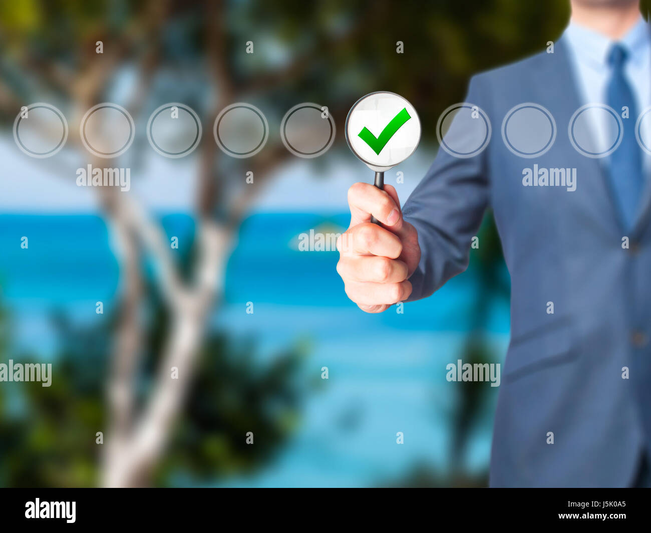 Businessman magnifying glass check mark on virtual screen. Magnifying ...