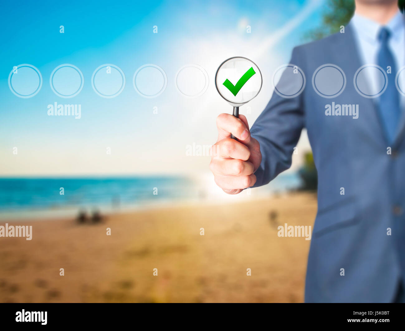 Businessman magnifying glass check mark on virtual screen. Magnifying ...