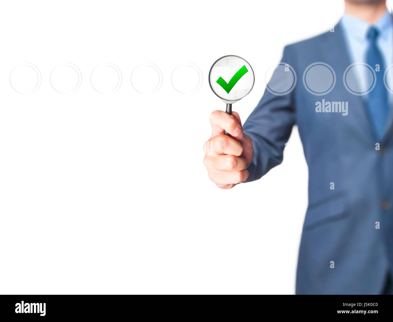 Businessman magnifying glass check mark on virtual screen. Magnifying ...