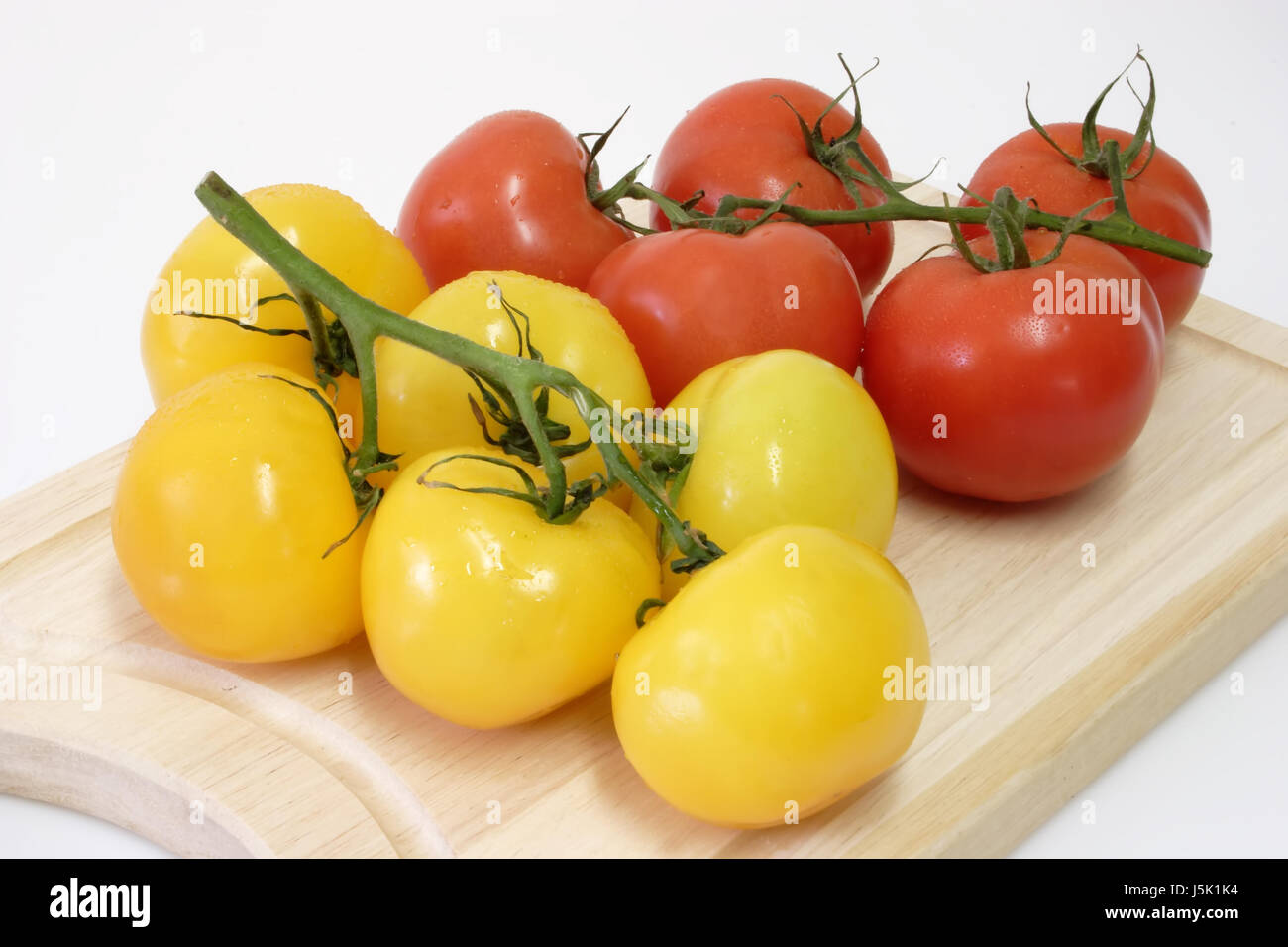 yellow and red tomatoes Stock Photo - Alamy