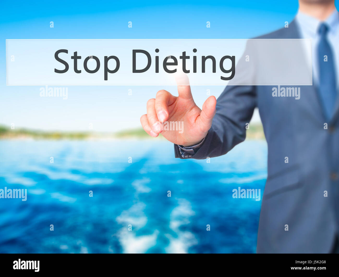 Stop Dieting - Businessman hand pressing button on touch screen ...