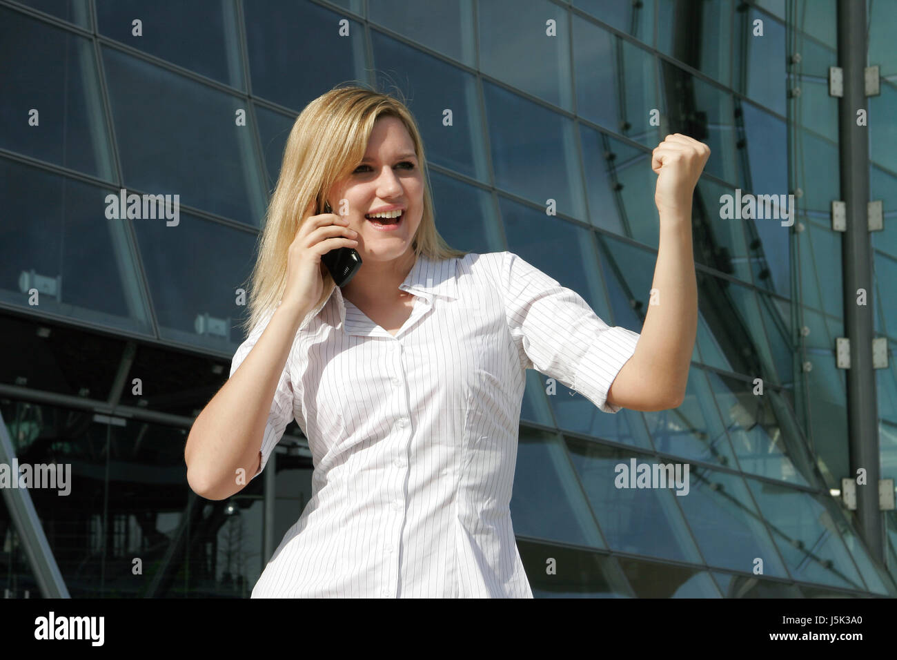 young woman in jubelpose Stock Photo - Alamy