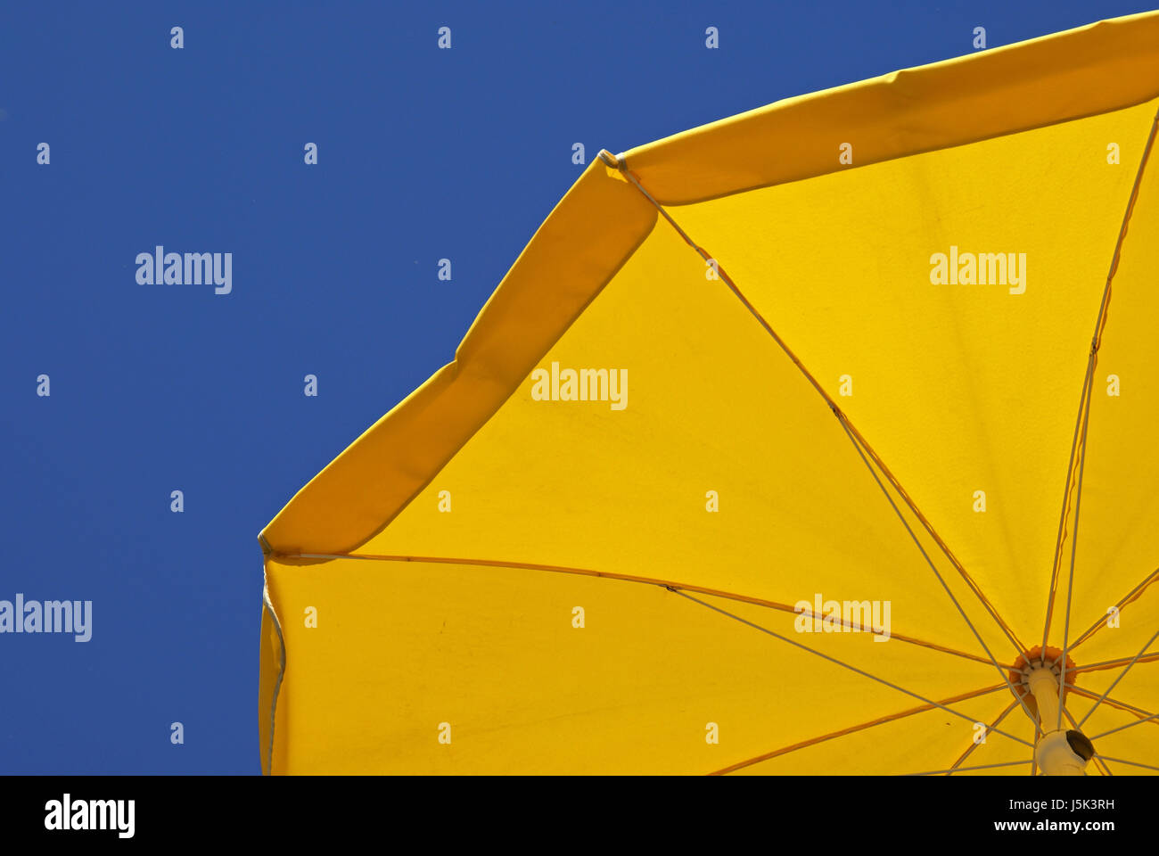 blue sunbeams contrast sunshade umbrella strikingly shelter from sun ...