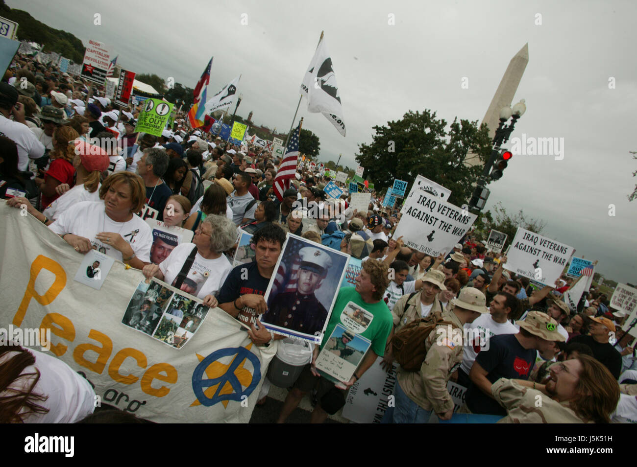 Carlos Arredondo, center, holds a photo of his son Pfc. Alexander ...