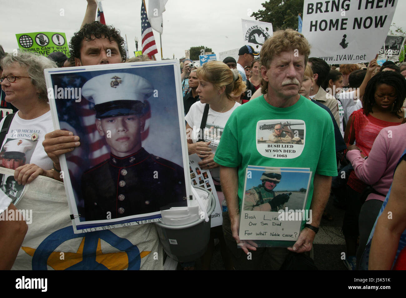 Carlos Arredondo, left, holds a photo of his son Pfc. Alexander ...