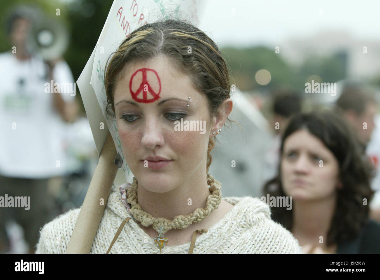 A woman with a peace sign during the Operation Ceasefire concert after ...