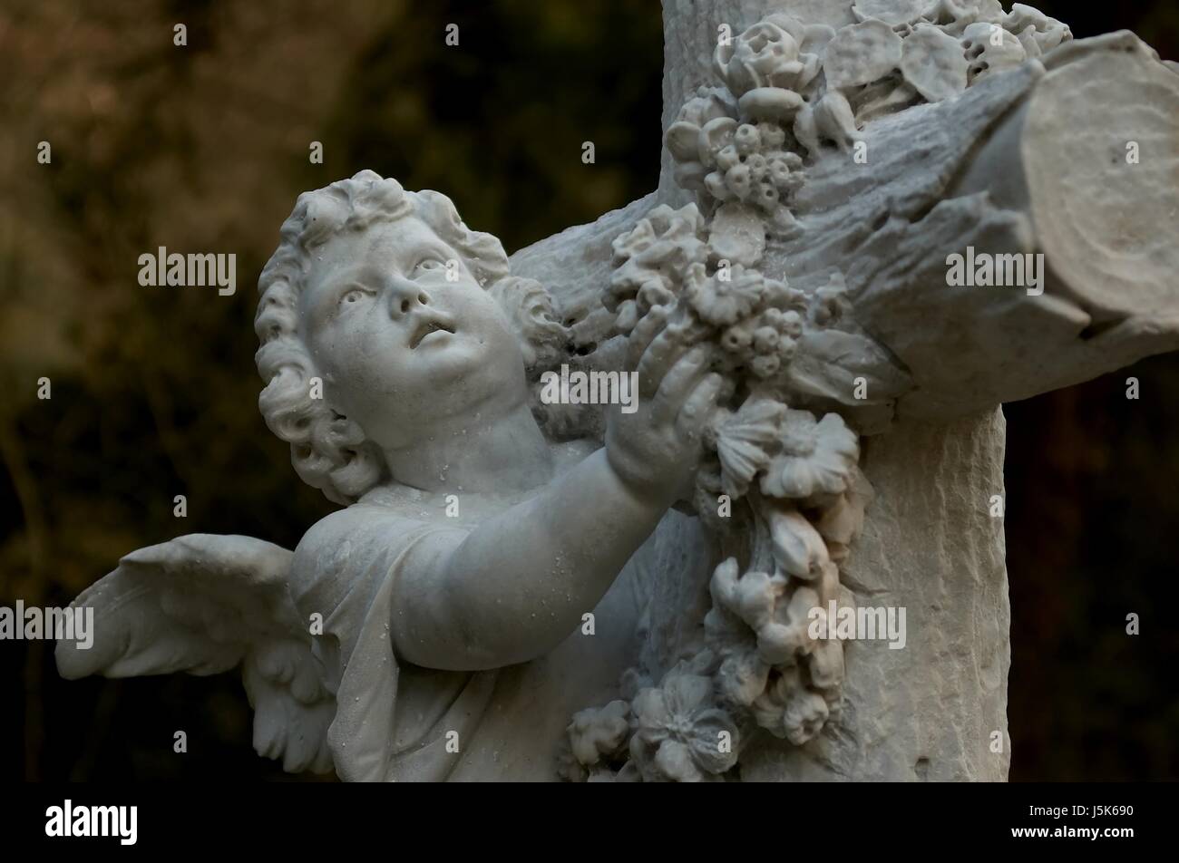 skyward statue portrait cross sculpture wing look glancing see view ...