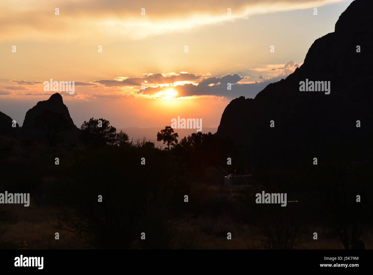 The sun sets through the Window at Chisos Mountain Basin in Big Bend ...