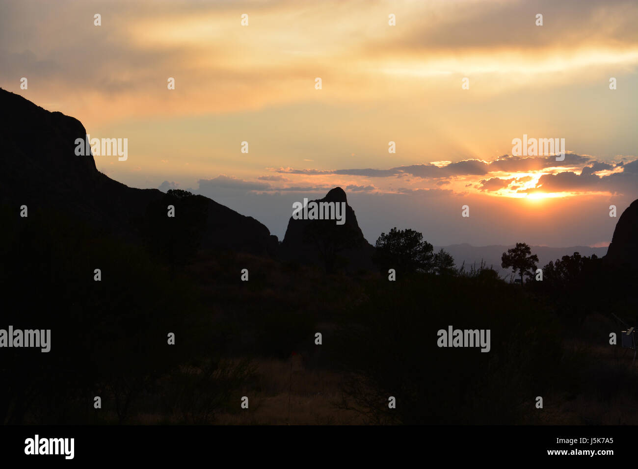 The sun sets through the Window at Chisos Mountain Basin in Big Bend ...