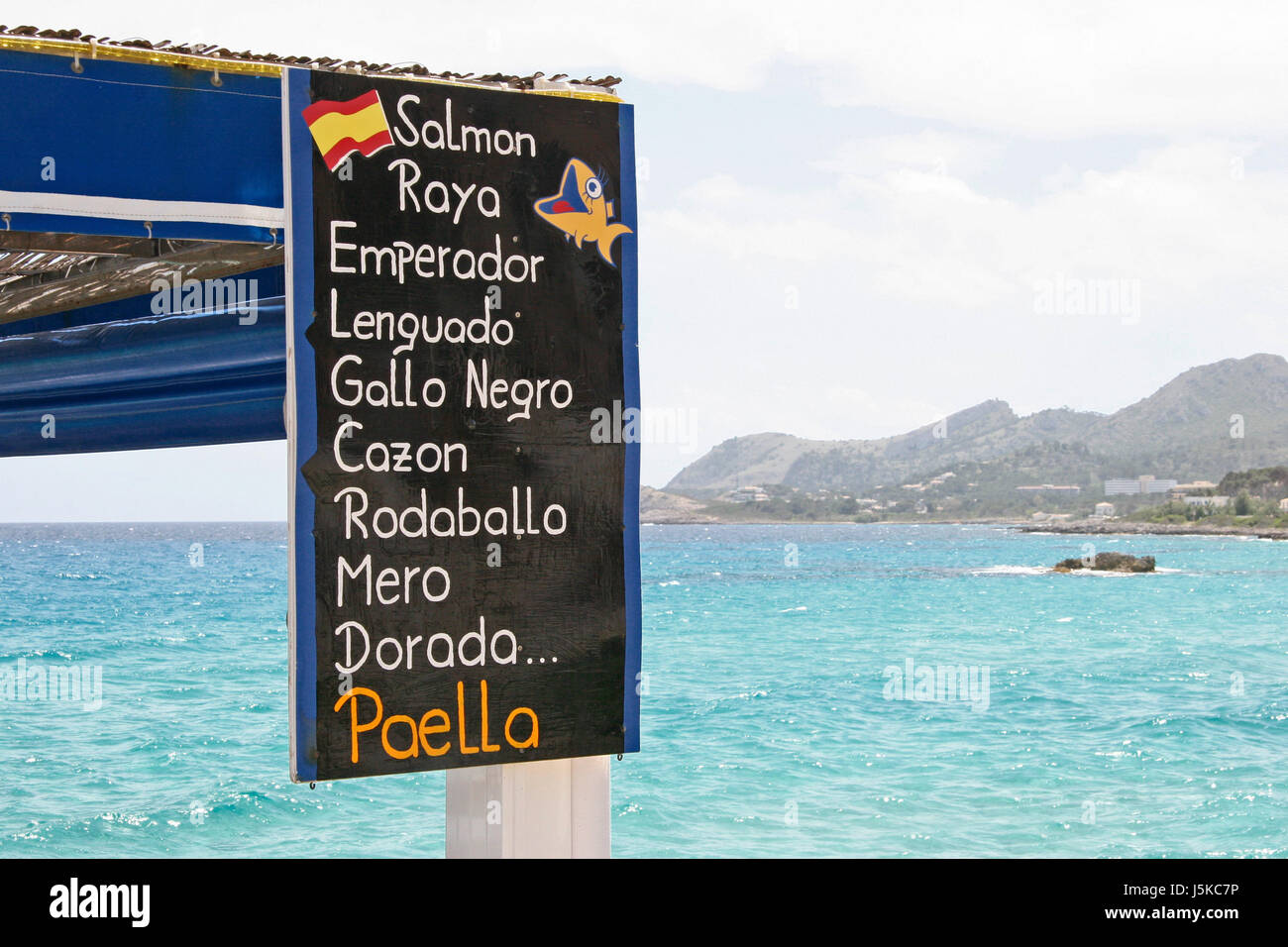 restaurant blue fish mallorca spain ocean view bay flag landscape ...