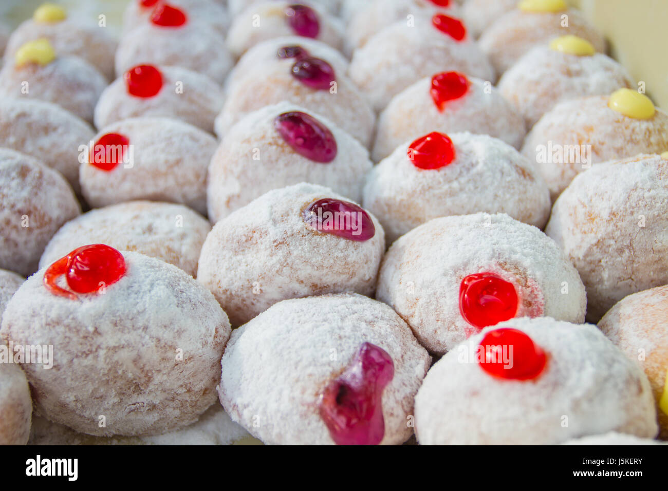 closeup Delicious a lot of donuts with icing Stock Photo - Alamy