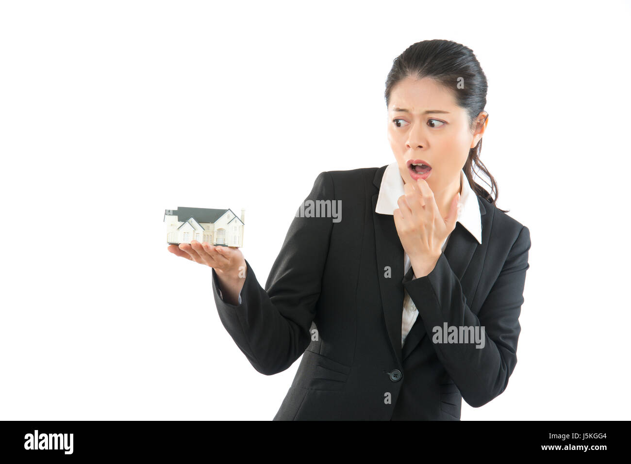 shocked house agent with her mouth opened. isolated on white background ...