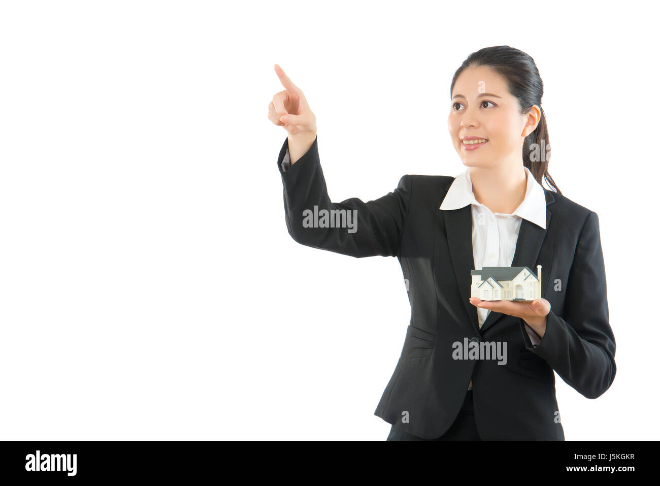 house saleswoman reporting pointing on white background. pretty asian ...
