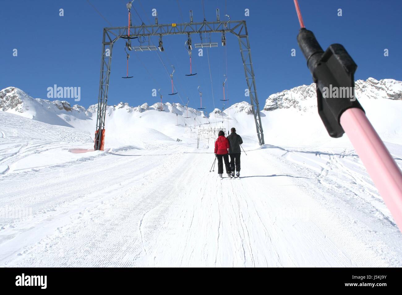 blue elevator lift mountains track hanger ropes ski skiing drag skier ...