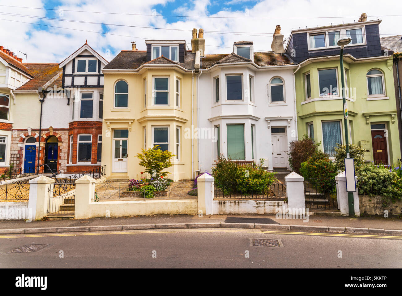 Typical English architecture, residential buildings in a row along the ...