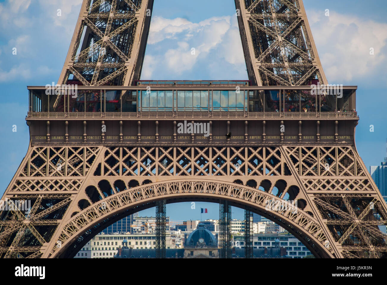 Lowest arch of Eiffel Tower Tour Eiffel blue sky steel structure Stock ...
