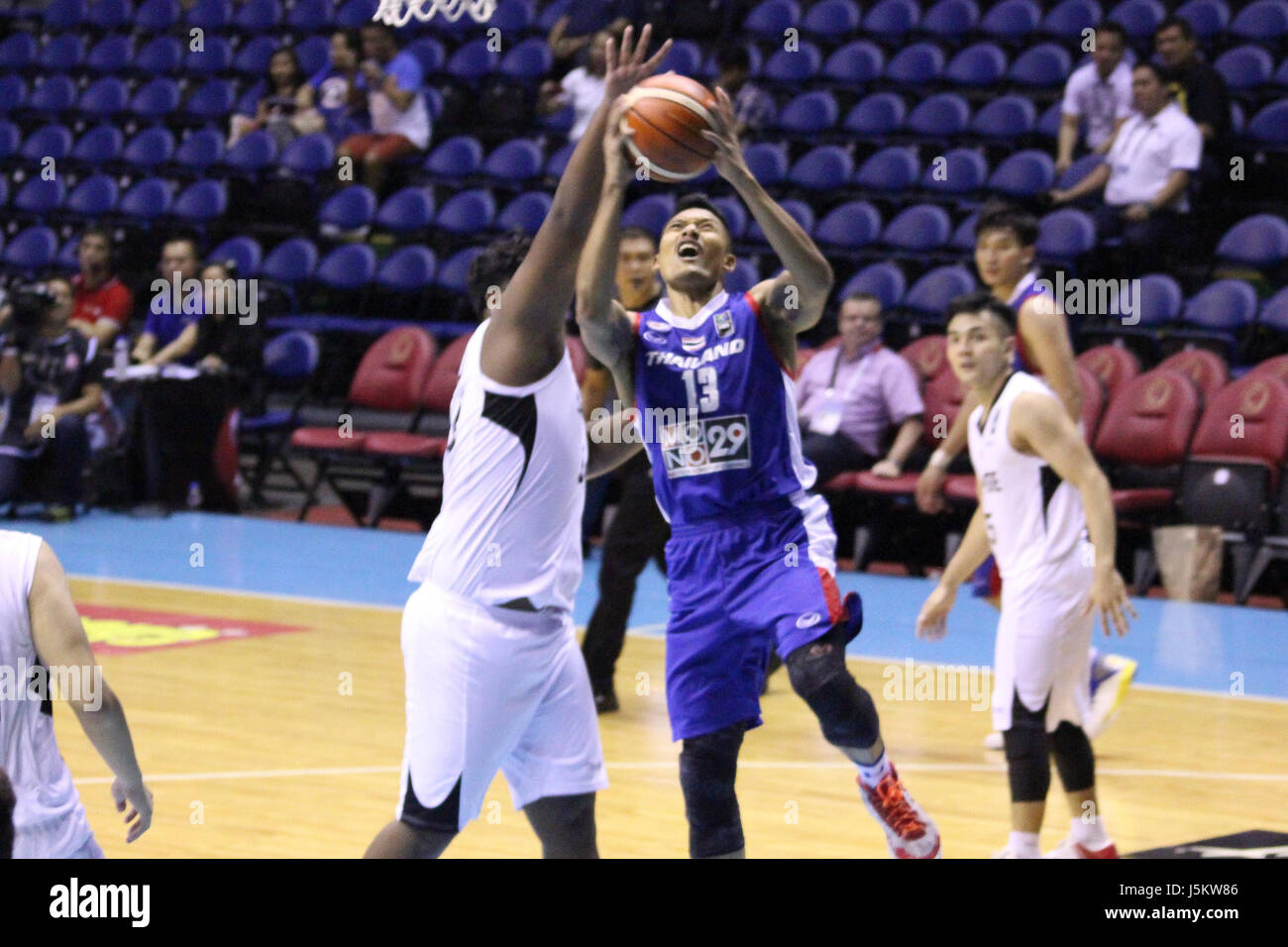 Klahan Chancharon (13) of Thailand gets fouled by Lavin Raj of ...