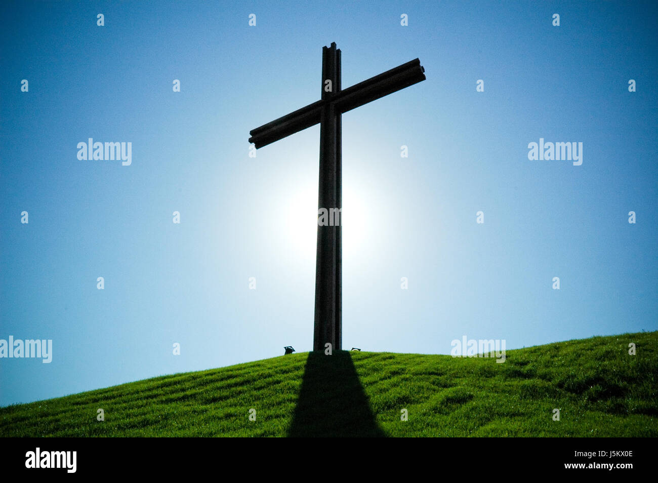 cross against blue sky Stock Photo - Alamy