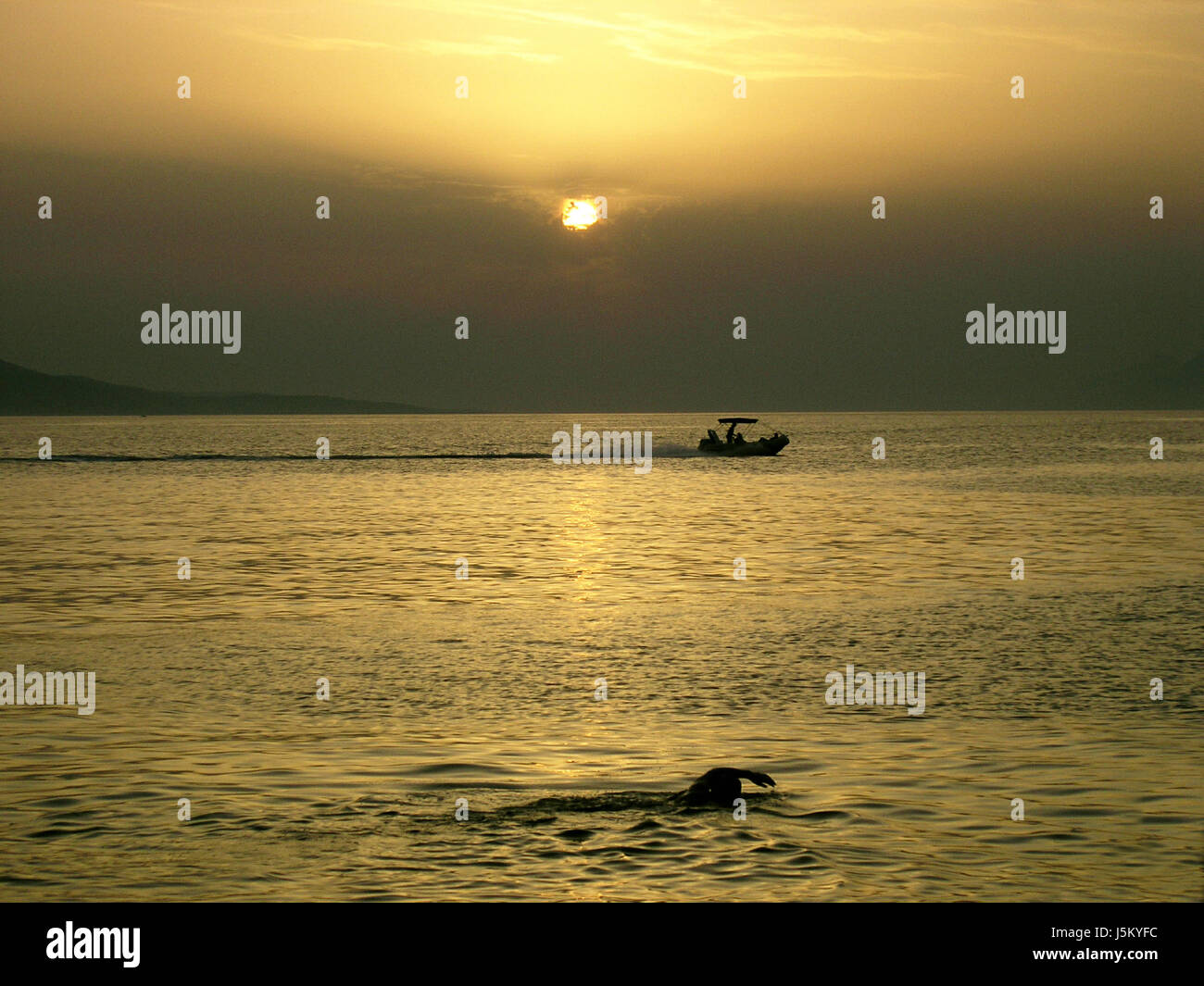 sunset evening salt water sea ocean water speed velocity float swimmer ...