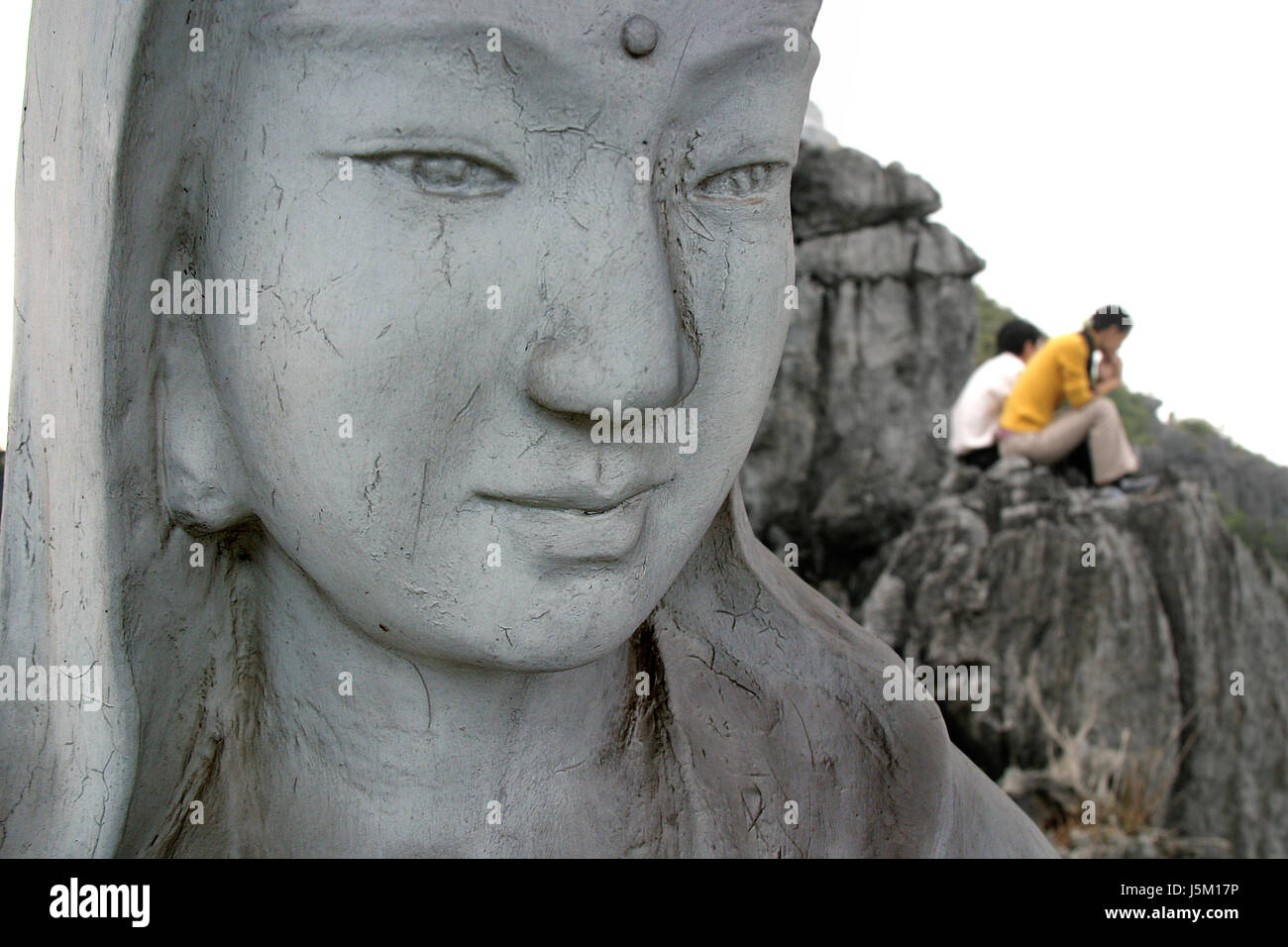 statue overlooks two people Stock Photo - Alamy