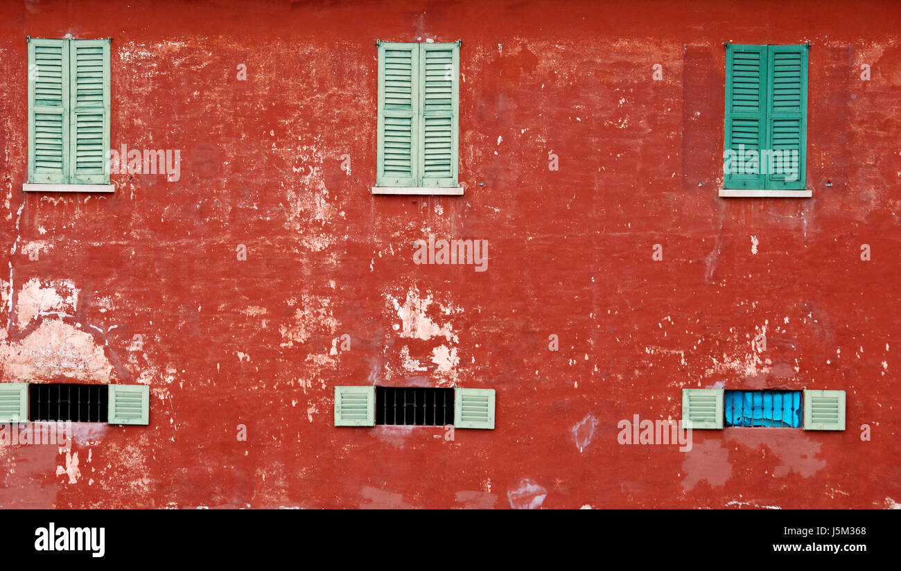 house building window porthole dormer window pane facade three shutters ...