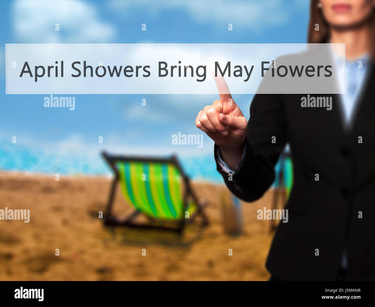April Showers Bring May Flowers - Isolated female hand touching or ...