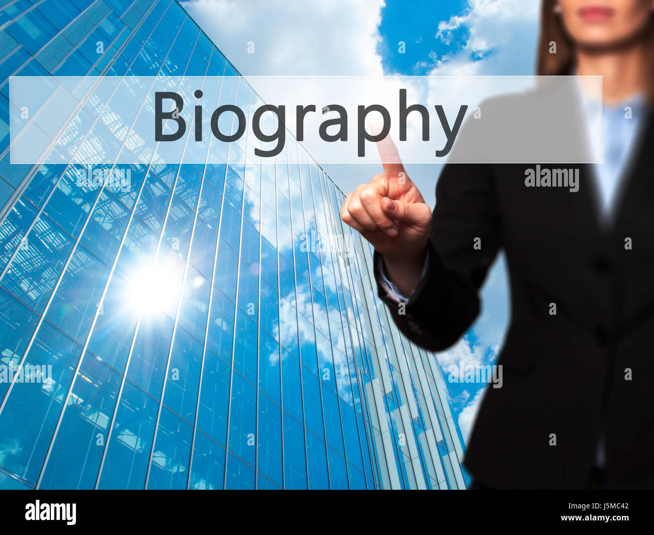 Biography - Young girl working with virtual screen and touching button ...