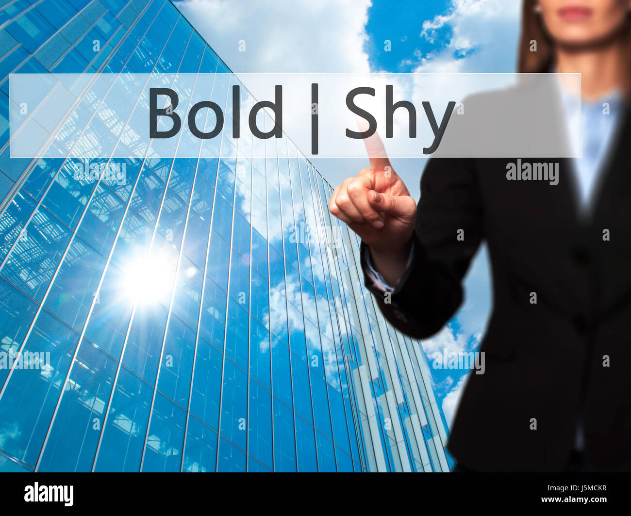 Bold Shy - Young girl working with virtual screen an touching button ...