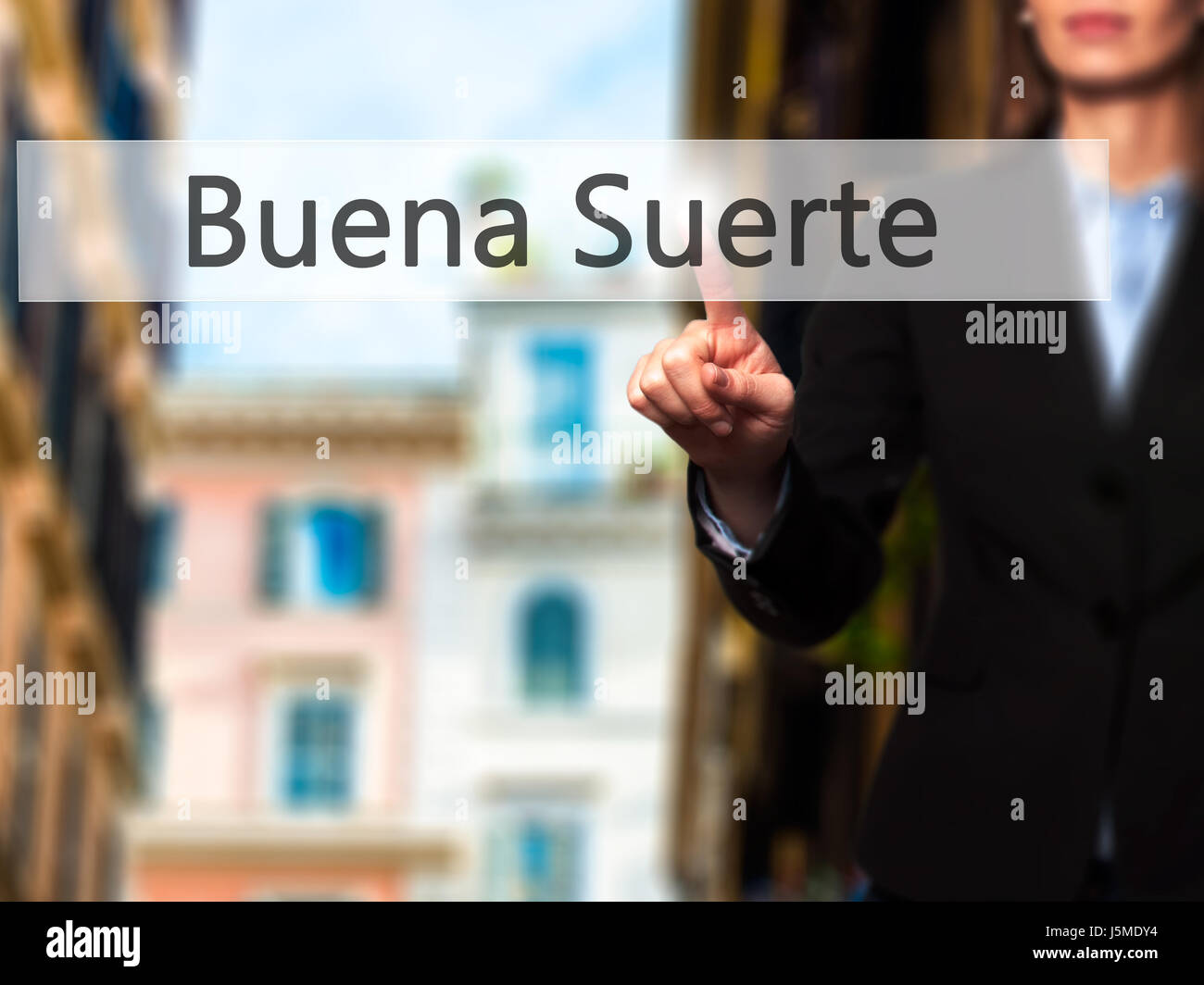 Buena Suerte ( Good Luck in Spanish) - Businesswoman pressing high tech ...