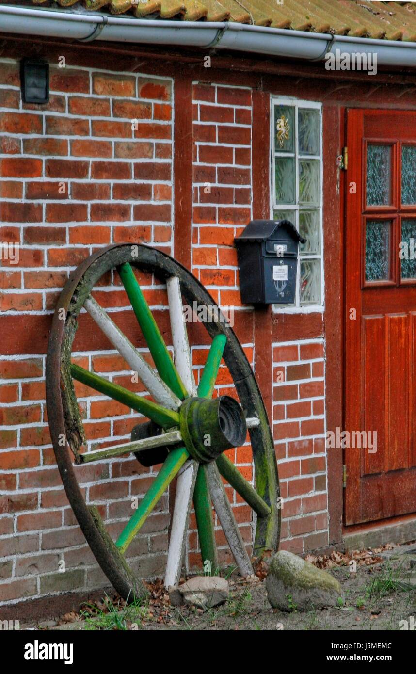 house building wheel entrance door house wall cartwheel lower saxony ...