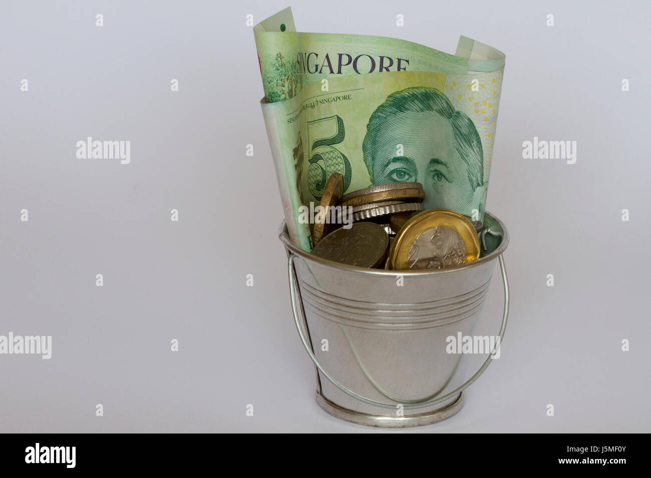 Money in a bucket hi-res stock photography and images - Alamy