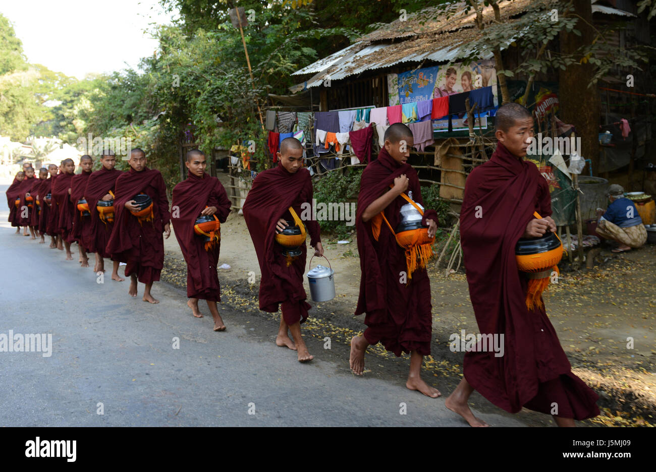Burmese Buddhist monks collecting alms, an everyday morning ritual ...
