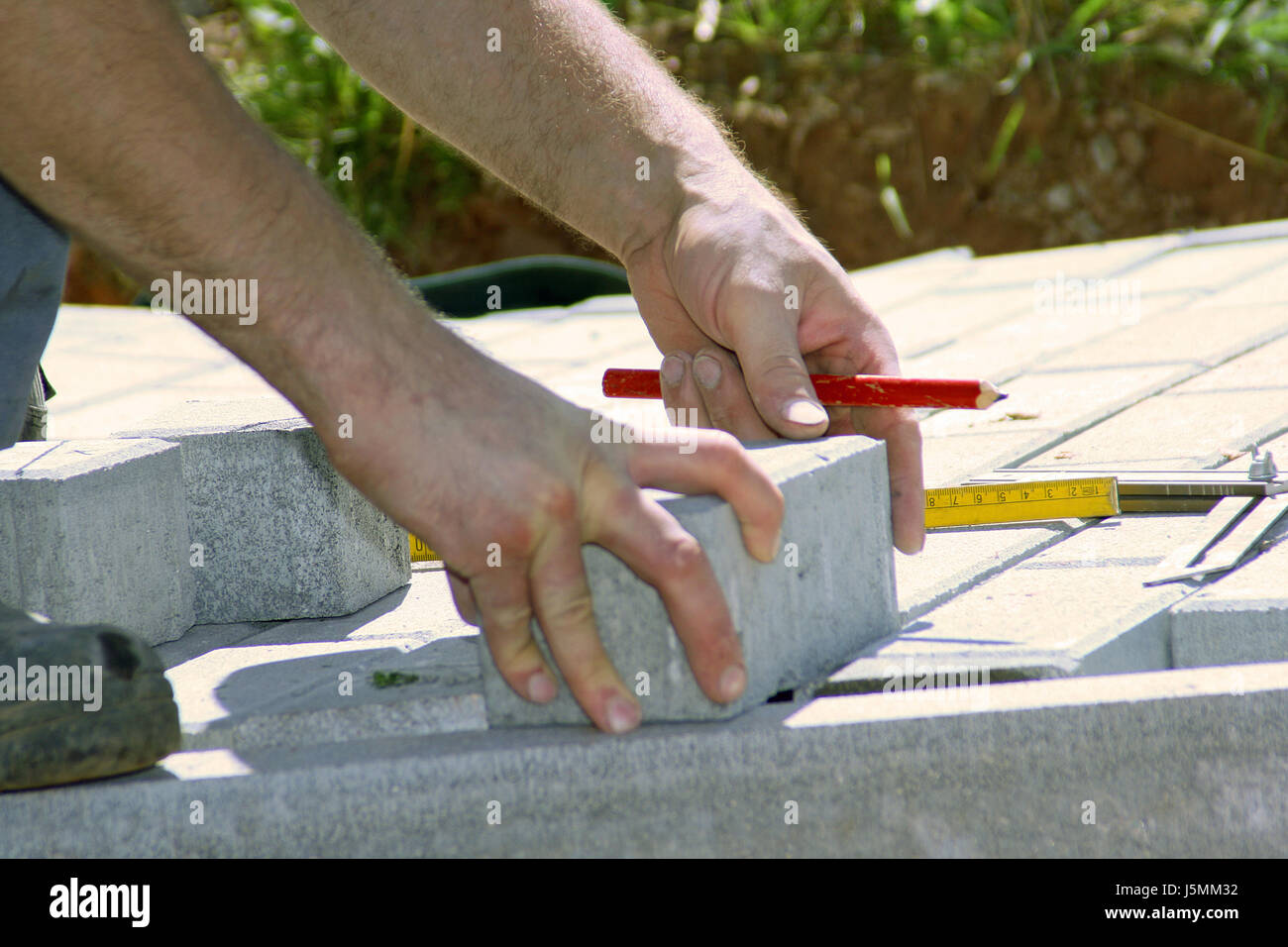 Laying cobblestones hi-res stock photography and images - Alamy