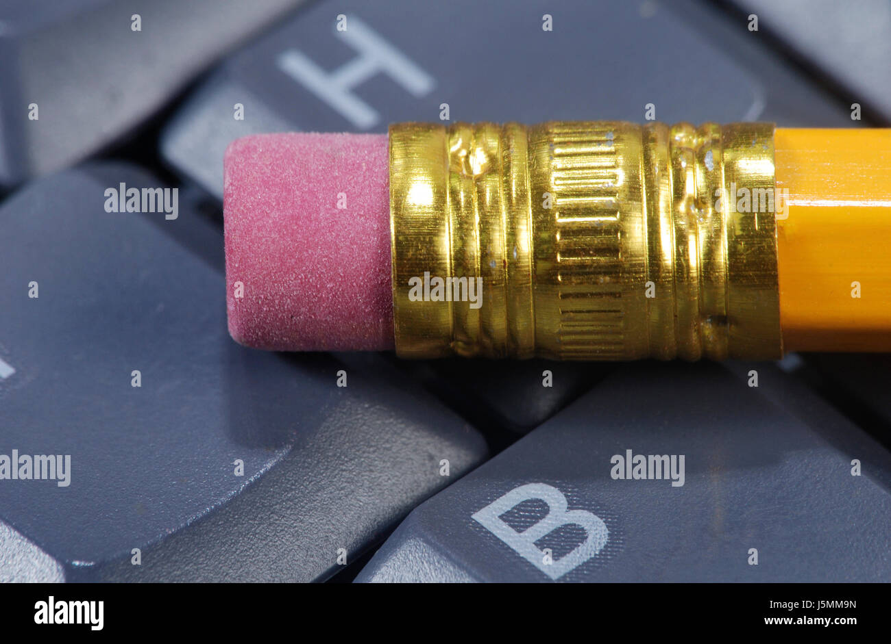 pencil on keyboard Stock Photo - Alamy