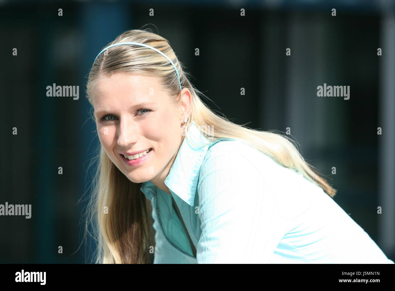 woman leaning forward Stock Photo - Alamy