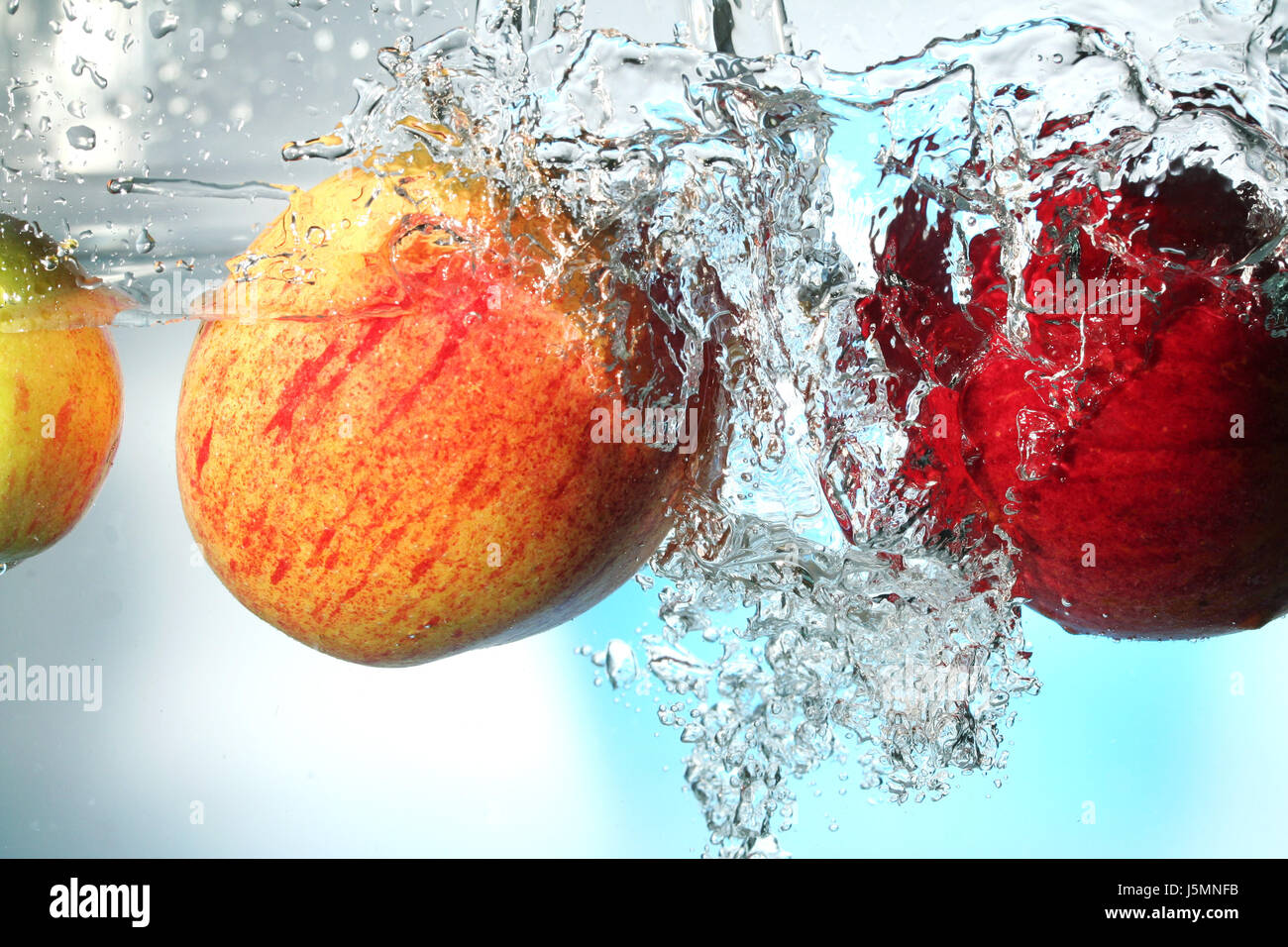 apple splash iii Stock Photo - Alamy